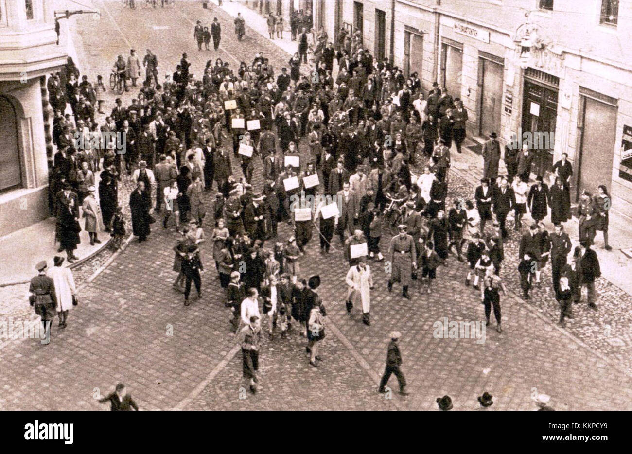 This historical photograph captures the procession of captured ...