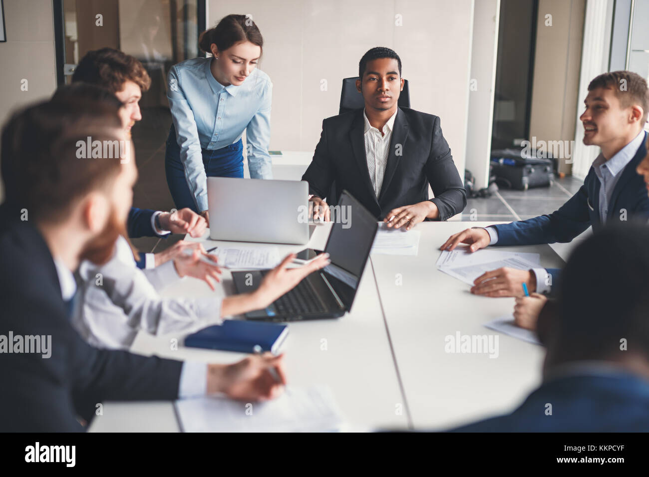 Boss heading a business reunion with partners Stock Photo - Alamy