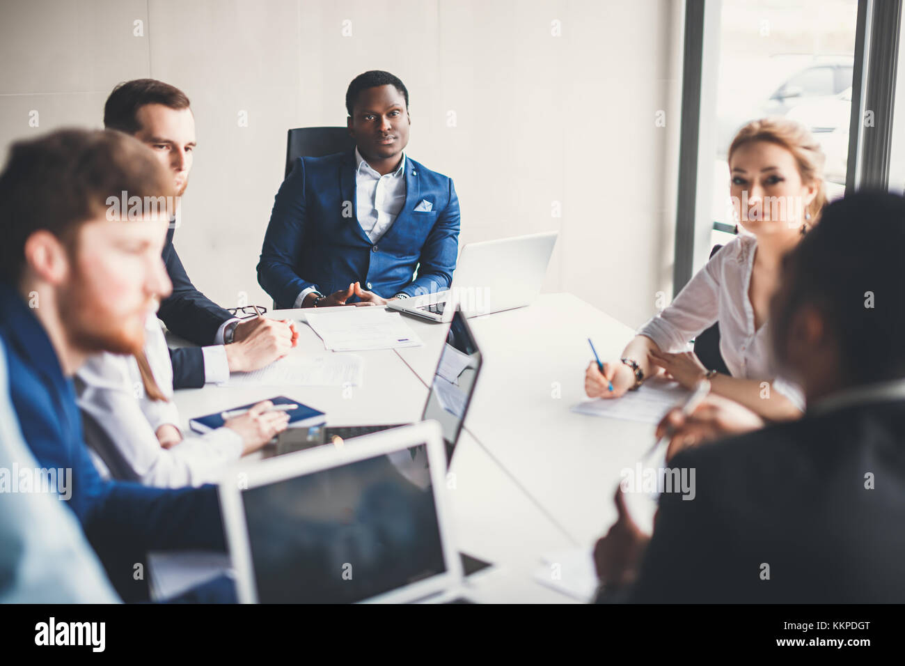Boss heading a business reunion with partners Stock Photo - Alamy