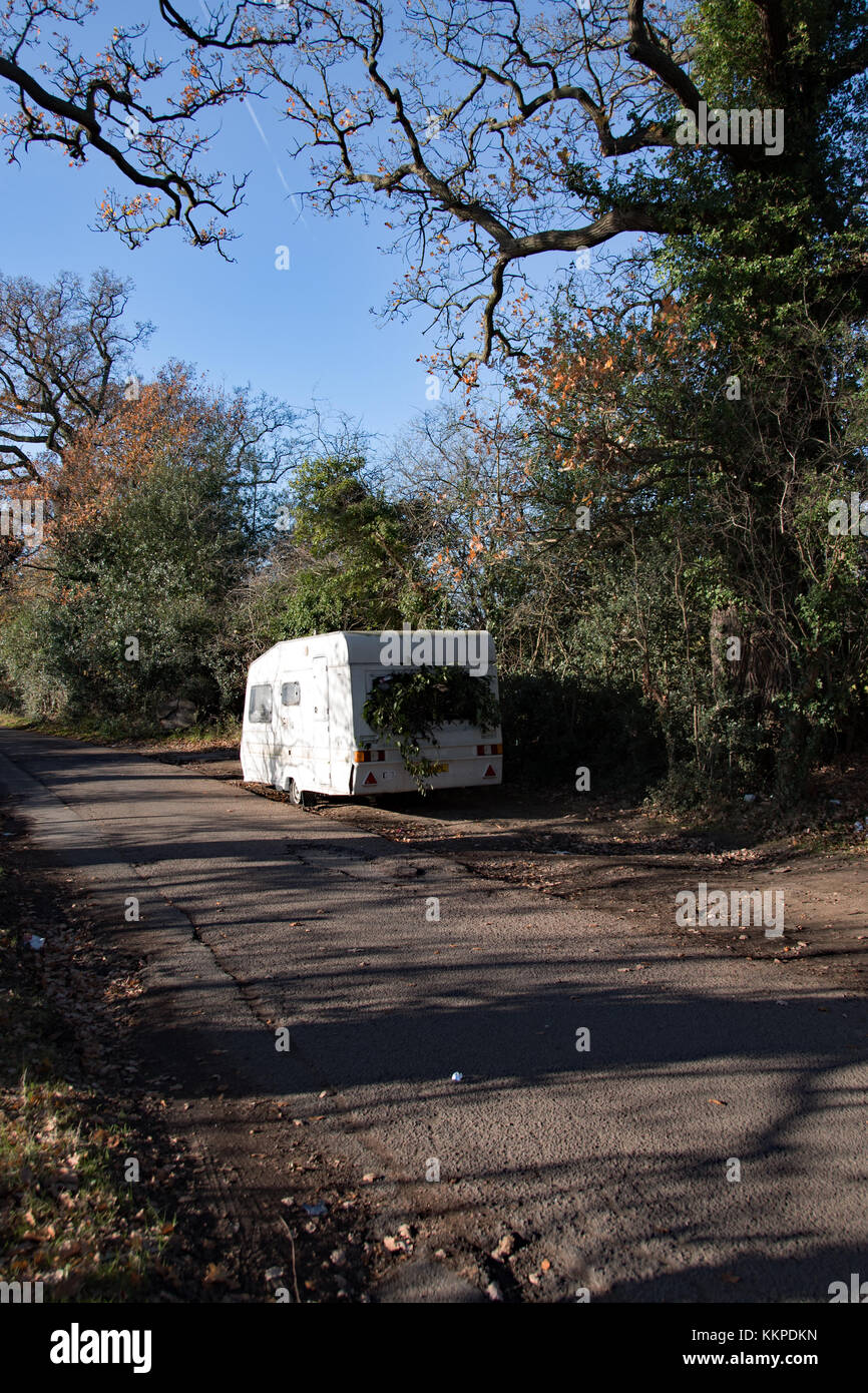 A travellers caravan loaded with garden waste is dumped in the leafy ...