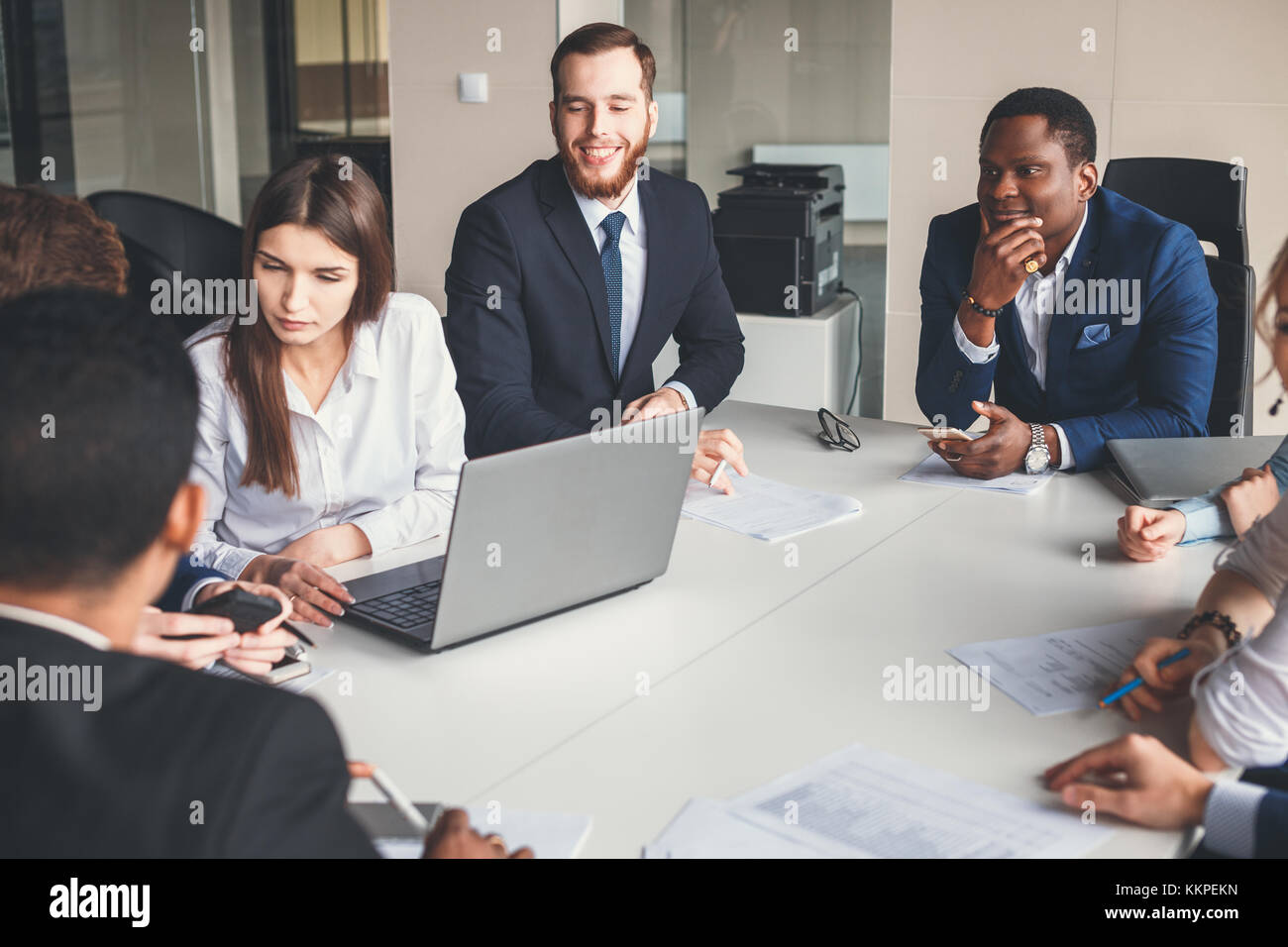 Boss heading a business reunion with partners Stock Photo - Alamy