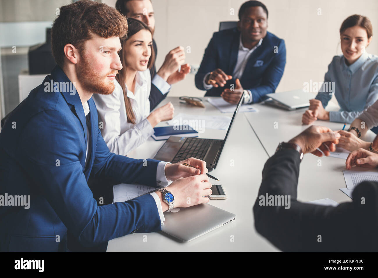 Boss heading a business reunion with partners Stock Photo - Alamy
