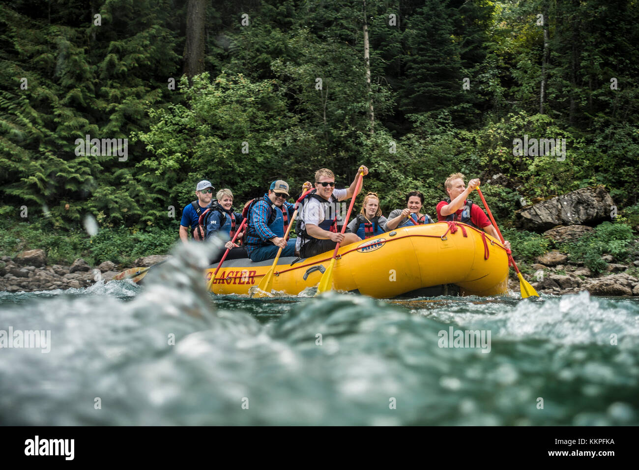 Tourists raft down the Middle Fork Flathead River the Glacier National ...