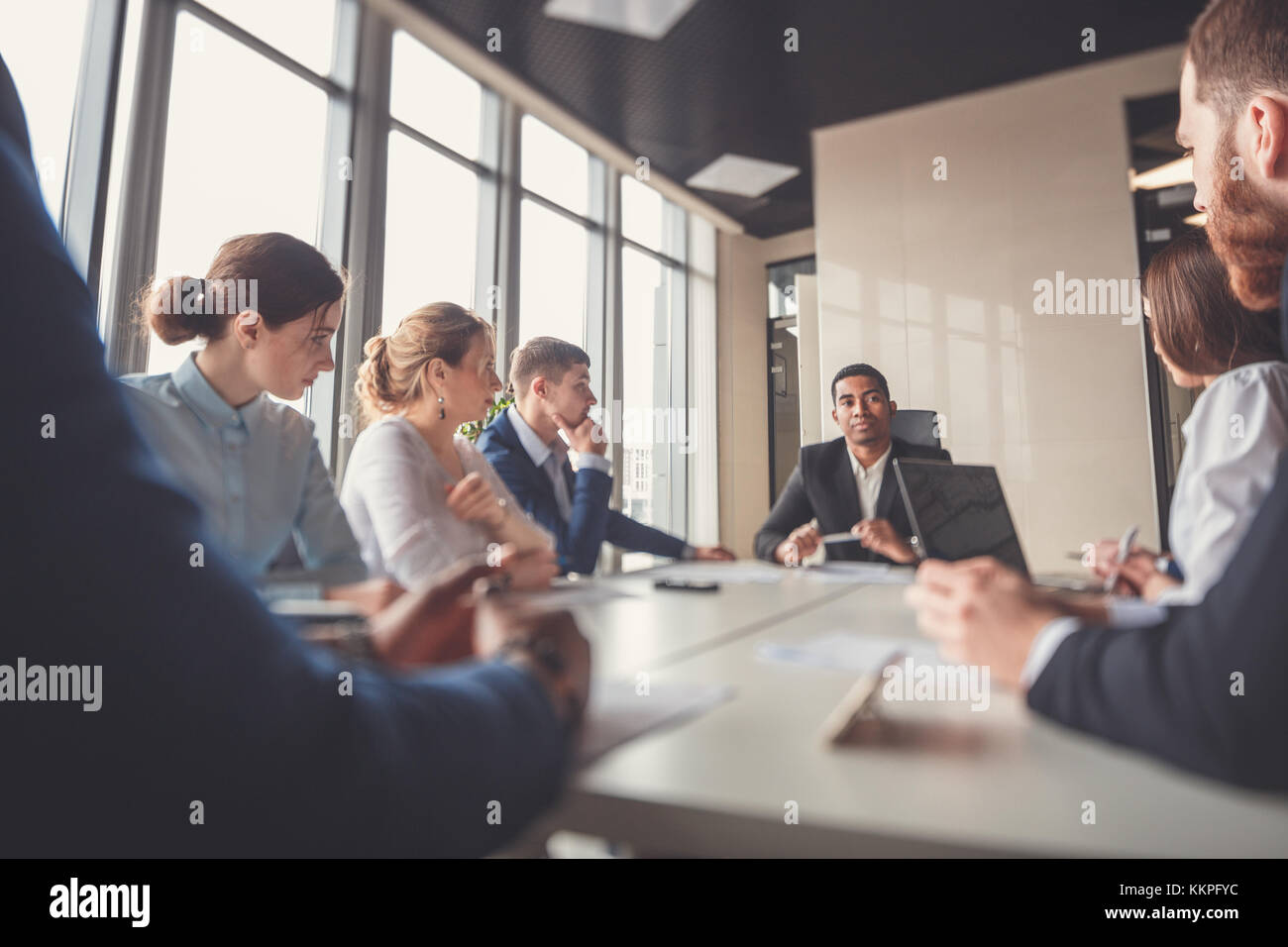 black leader of the business people giving a speech in a conference ...