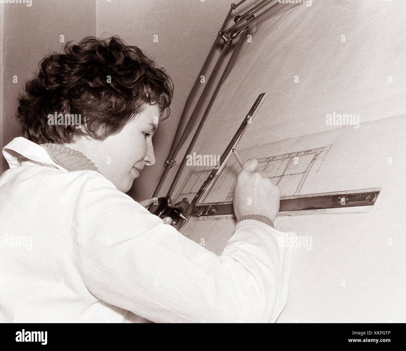 The image depicts a scene from 1962 at a project office, showcasing the ...