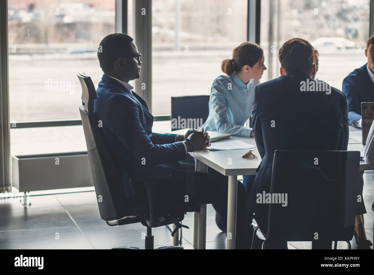 Boss heading a business reunion with partners Stock Photo - Alamy