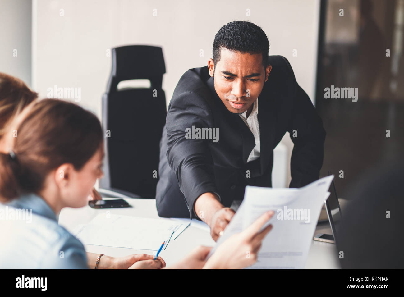 Young African American Business Man leading a team Stock Photo - Alamy