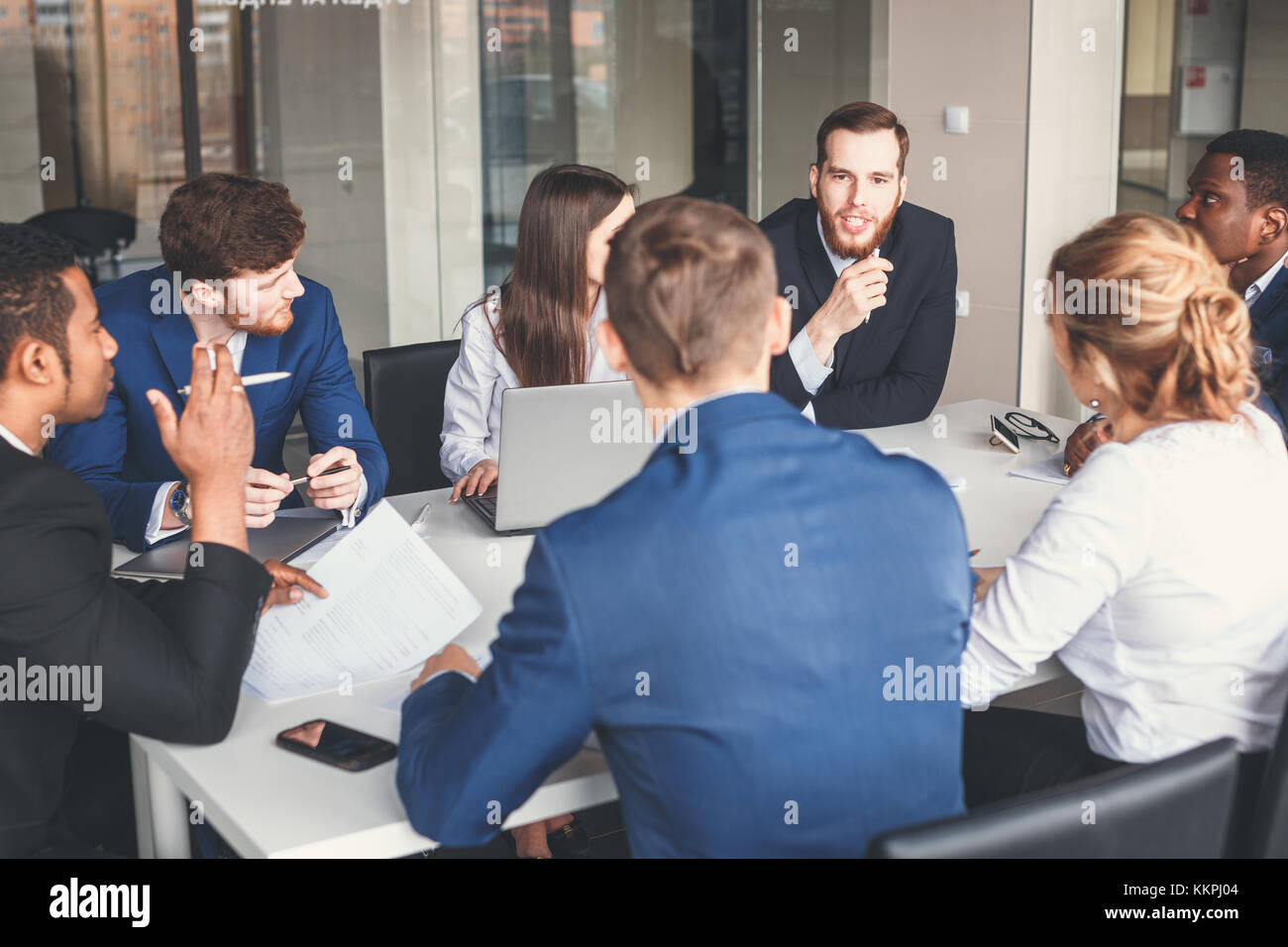 business team and manager in a meeting Stock Photo - Alamy