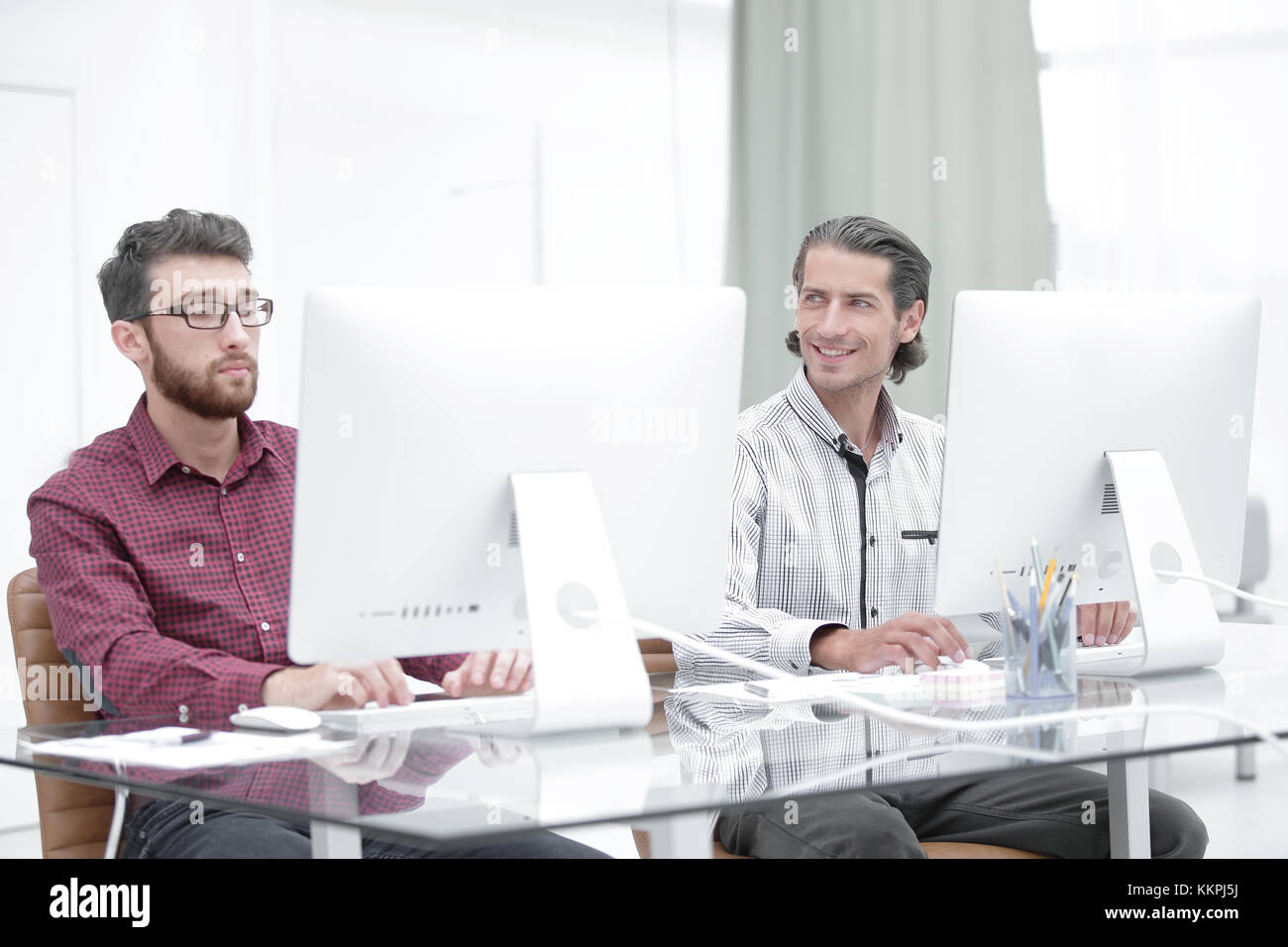 employees working at their Desk Stock Photo - Alamy
