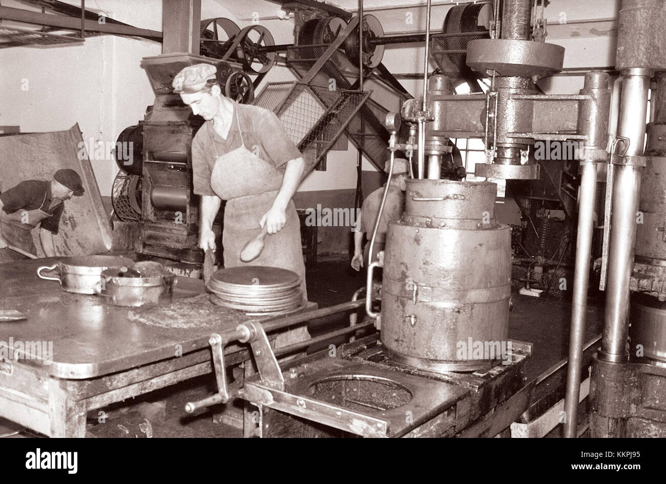 This 1960 photograph captures the interior of the oil factory in ...