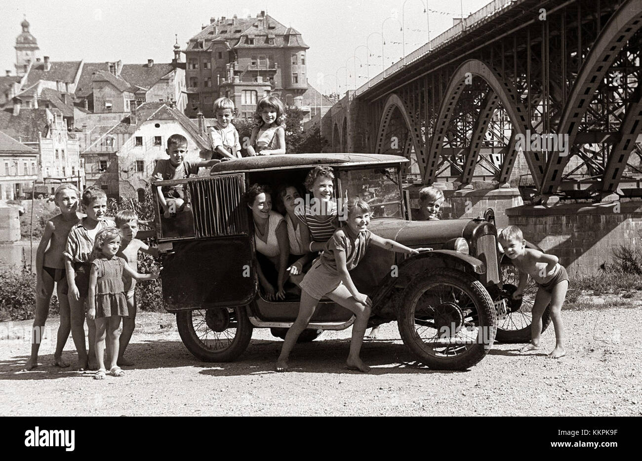 This photograph shows children around a Dixi car in 1958, capturing a ...