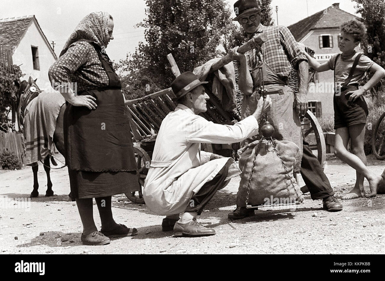 Farmers selling potatoes in Maribor in 1957, reflecting the ...
