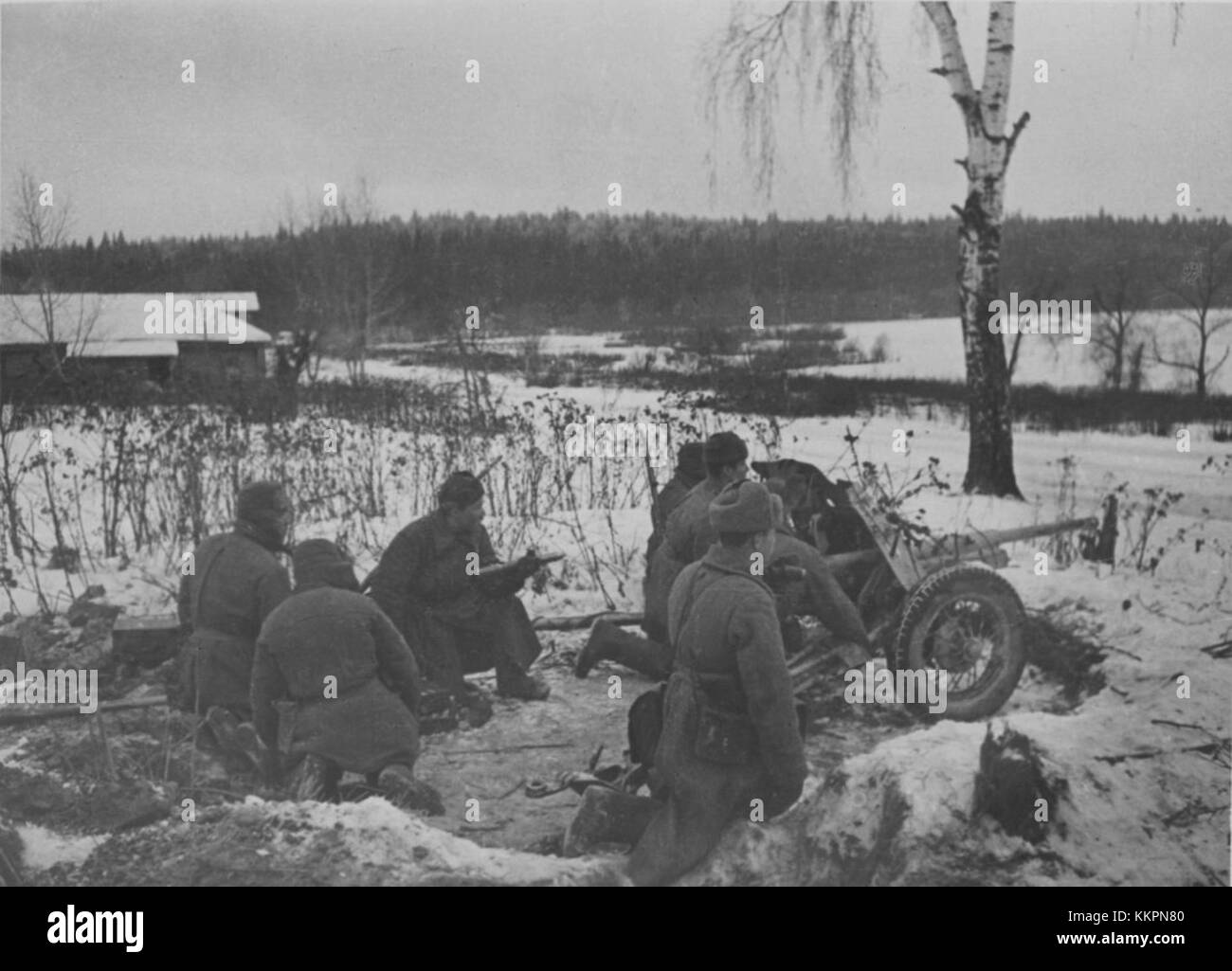 Soviet artillerymen are shown operating the 53 K artillery gun, a ...