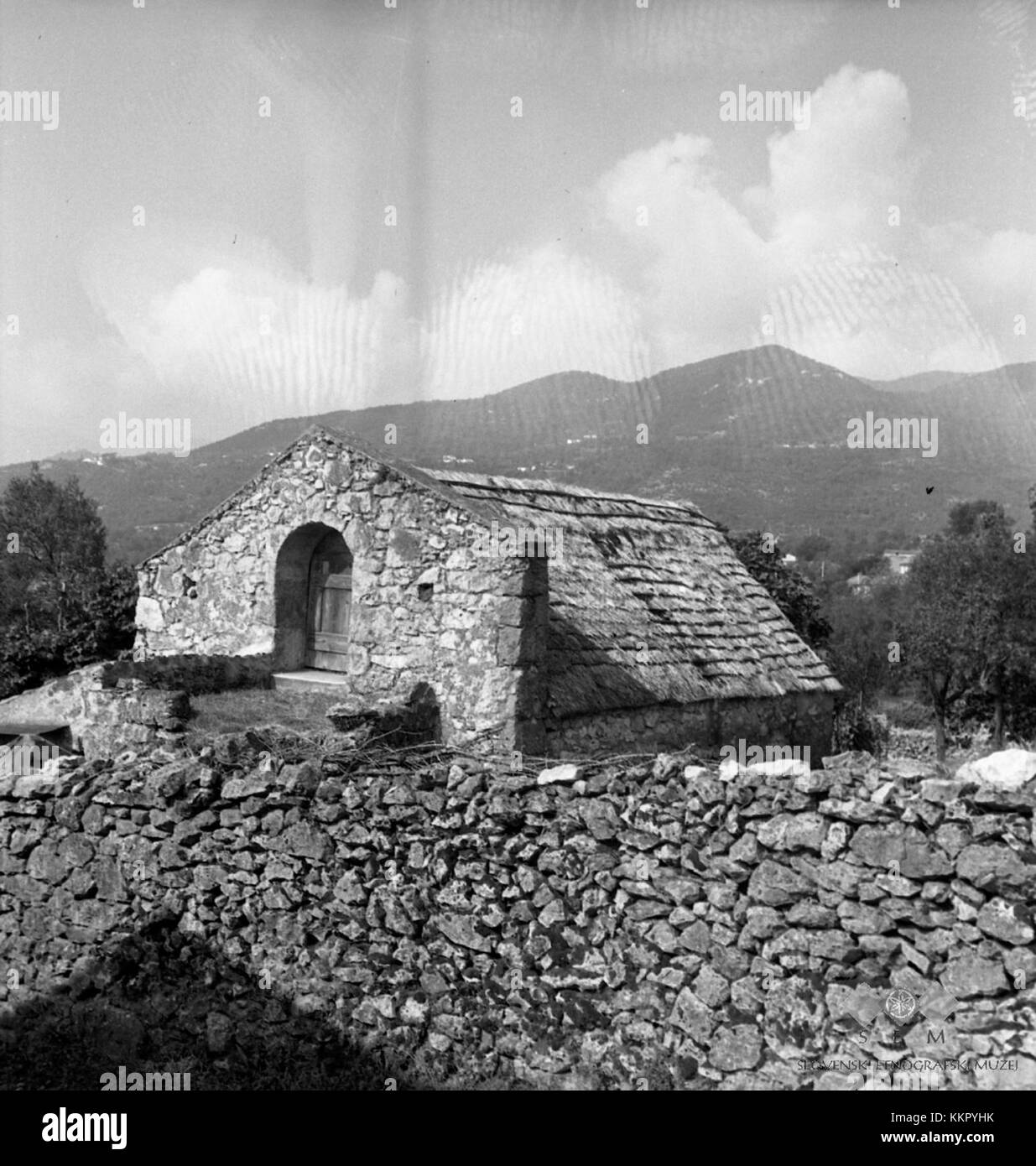 A photograph from 1955 captures the rural landscape of Senik with ...