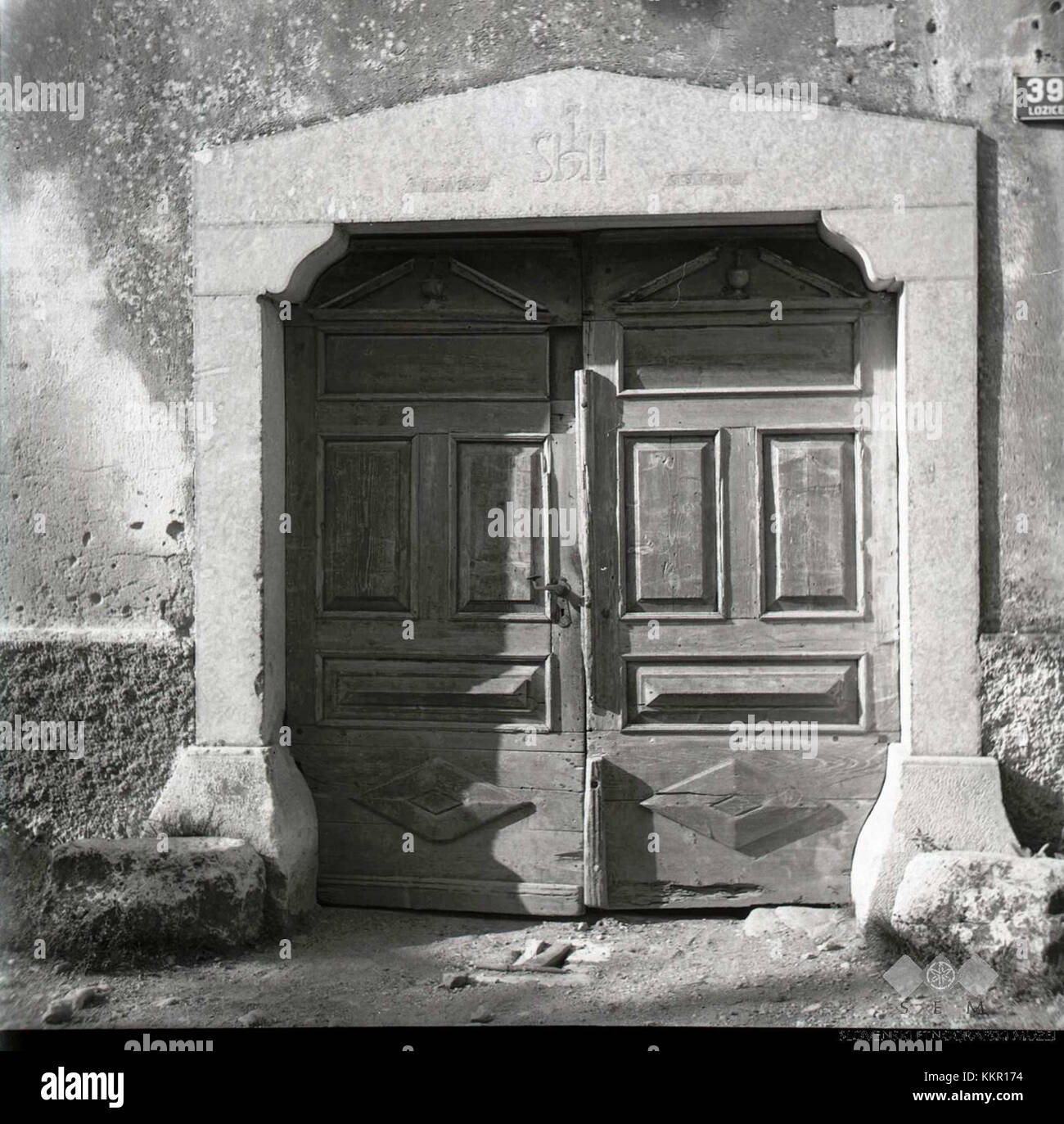 Photograph of a historical door with a column, taken at Jernej’s house ...