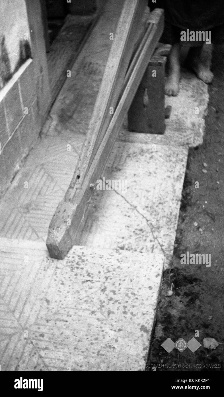 This photograph from 1963 shows the traditional flax spinning process ...
