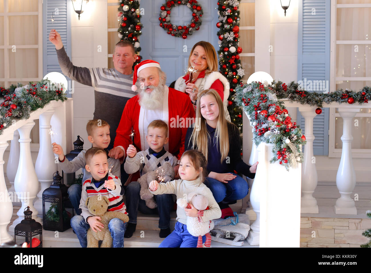 large European family with father Christmas looking forward to New Year ...