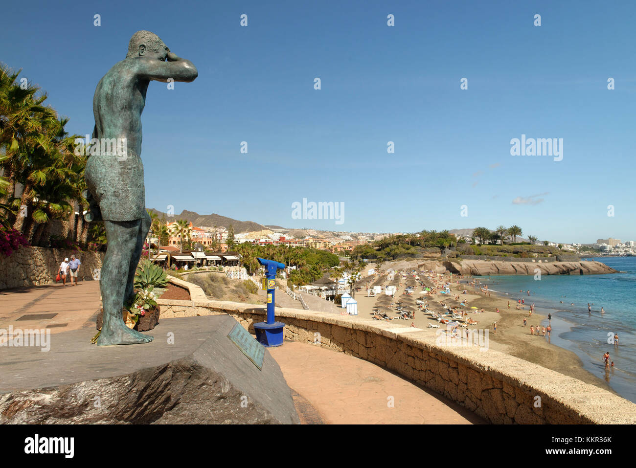 Statue Javier Perez Ramos with view on the beach Playa del Duque at the Costa Adeje, Tenerife ...