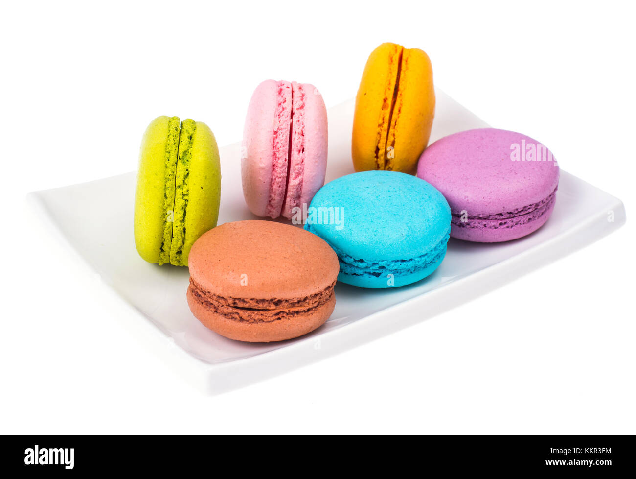 Macaroni tasty French dessert on white plate Stock Photo - Alamy