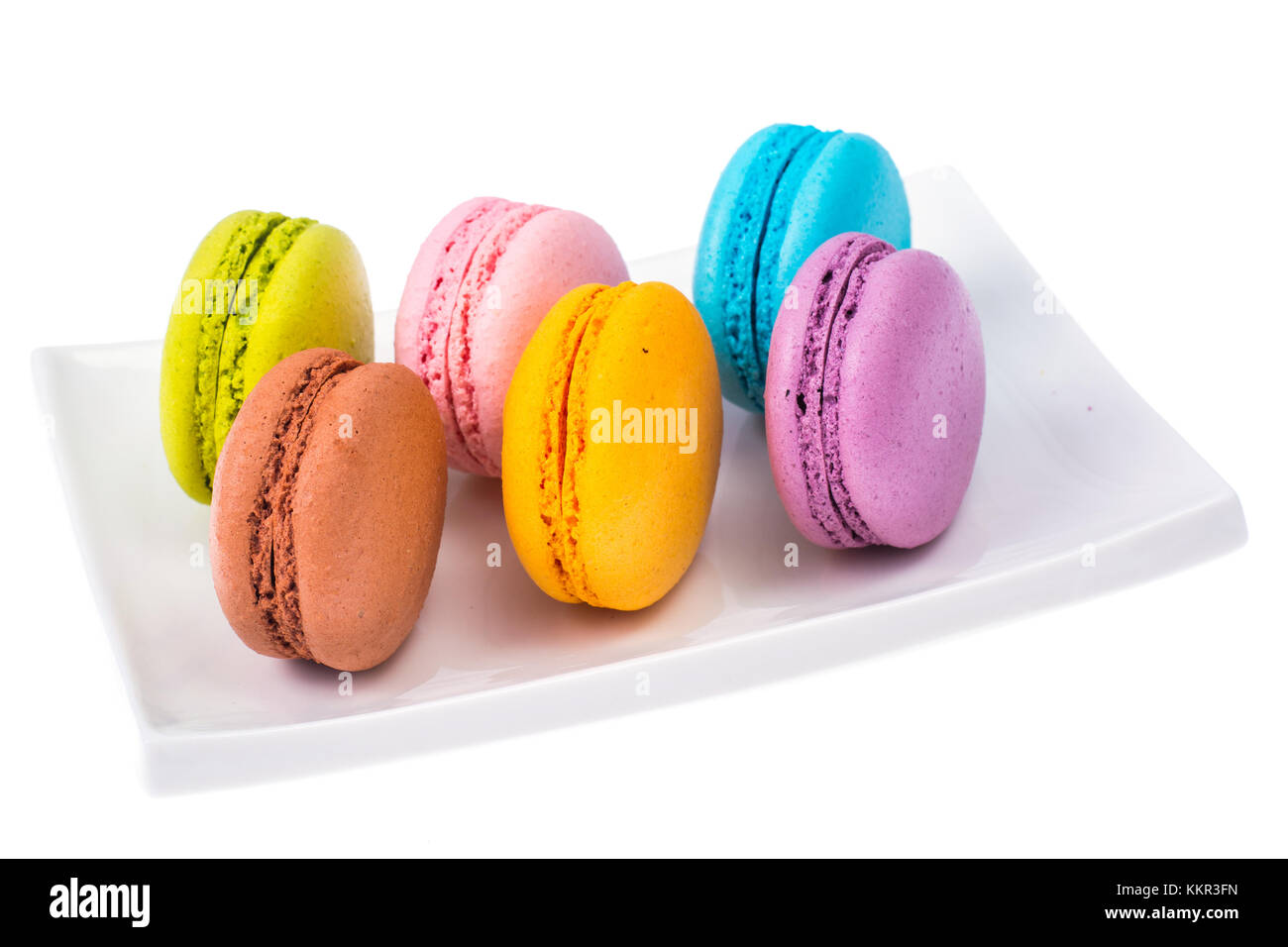 Macaroni tasty French dessert on white plate Stock Photo - Alamy