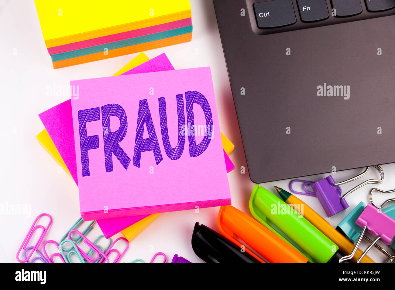 Writing text showing Fraud made in the office with surroundings such as ...