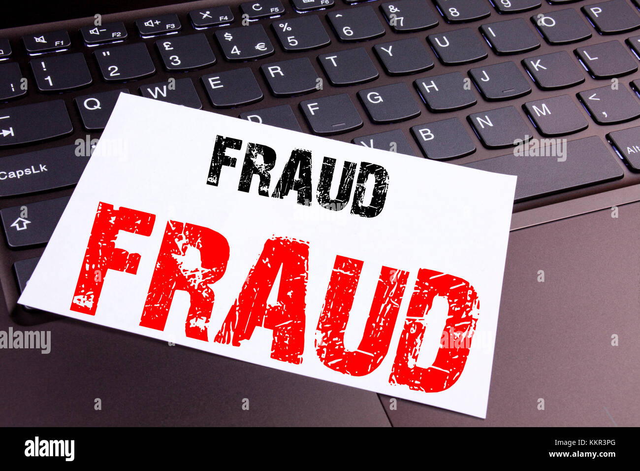 Writing Fraud text made in the office close-up on laptop computer ...