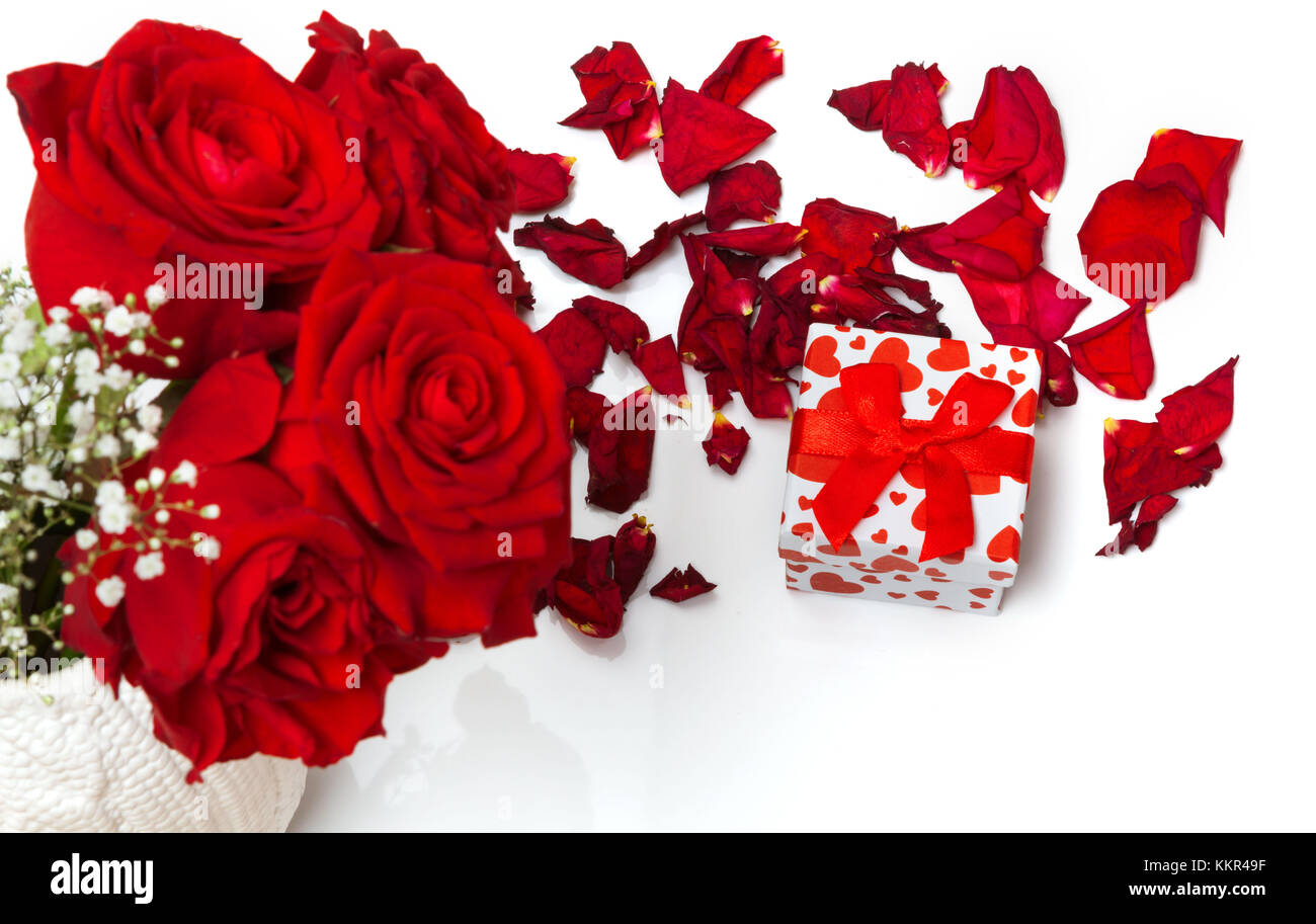 Red roses and present Stock Photo - Alamy