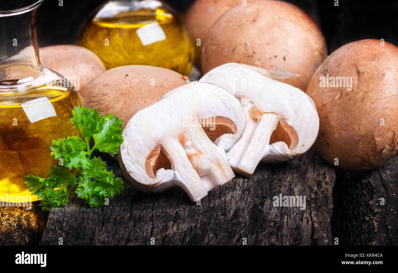 Brown champignons, mushroom oil Stock Photo - Alamy