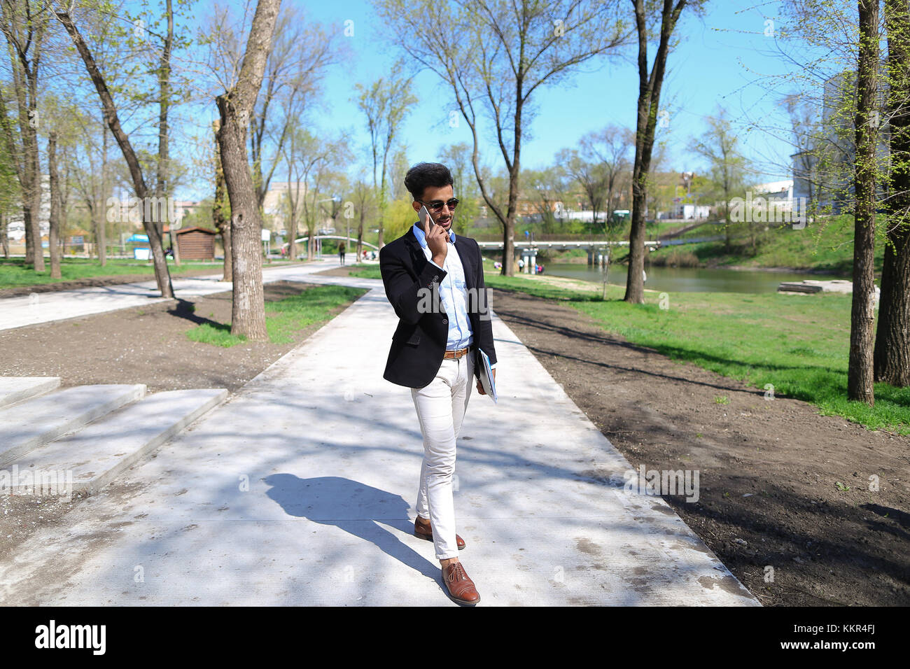 Boy dancing, twist and throw jacket over shoulder in slow motion. Man ...
