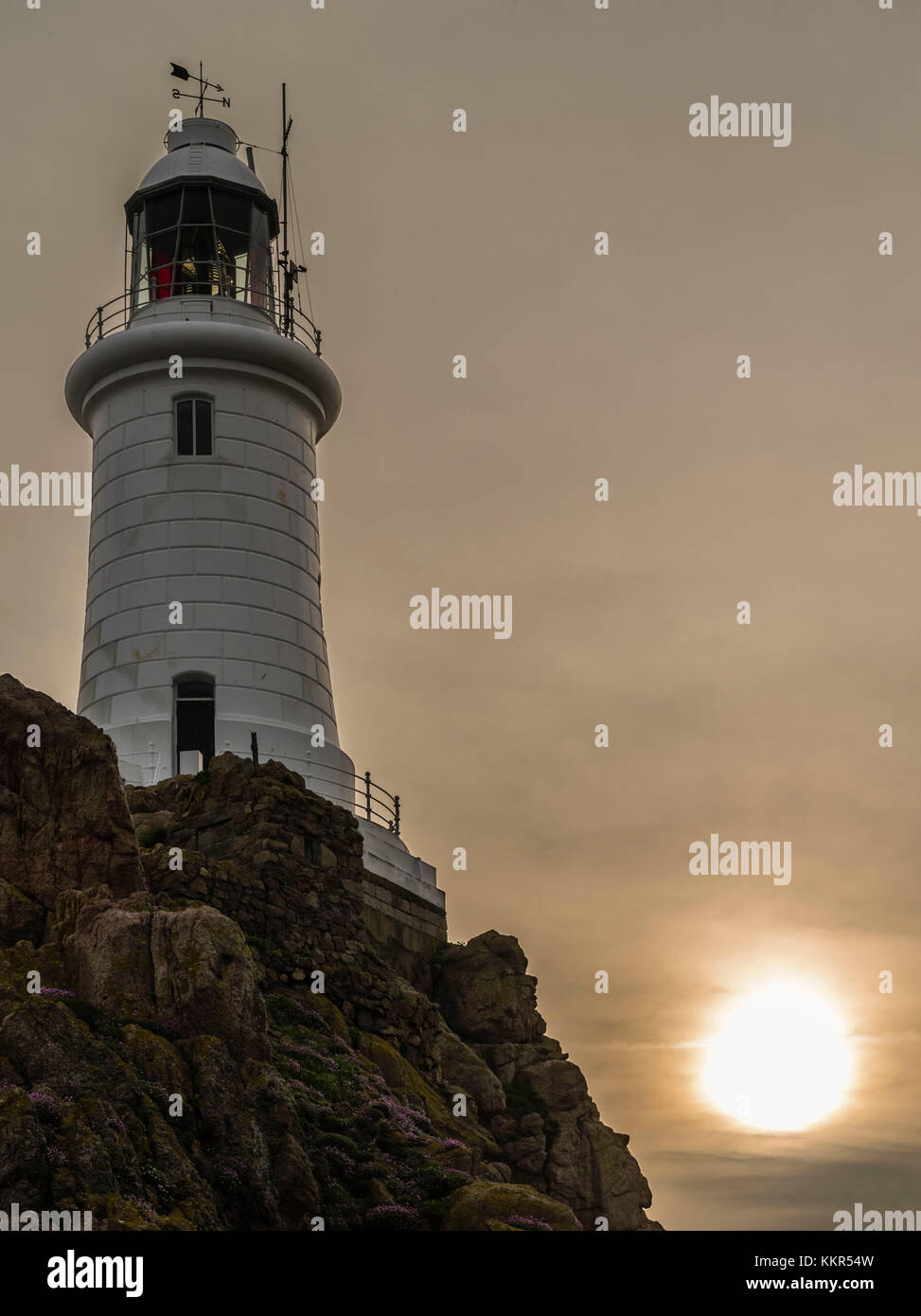 Lighthouse la corbiere on jersey at sunset hi-res stock photography and ...