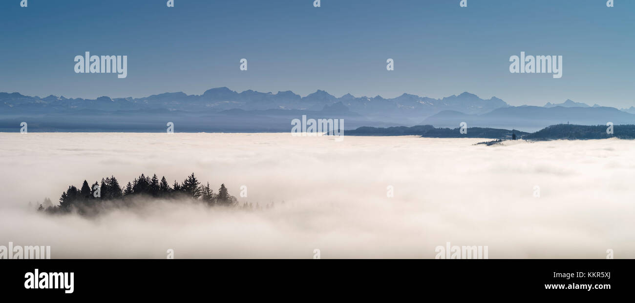 Fog island above high fog Stock Photo - Alamy