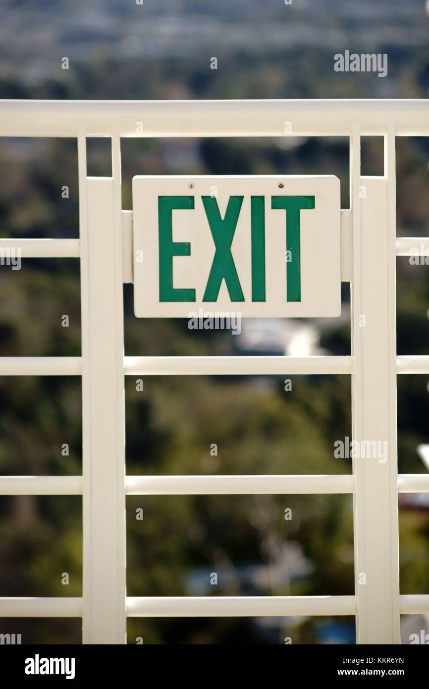 Exit sign on a railing Stock Photo - Alamy