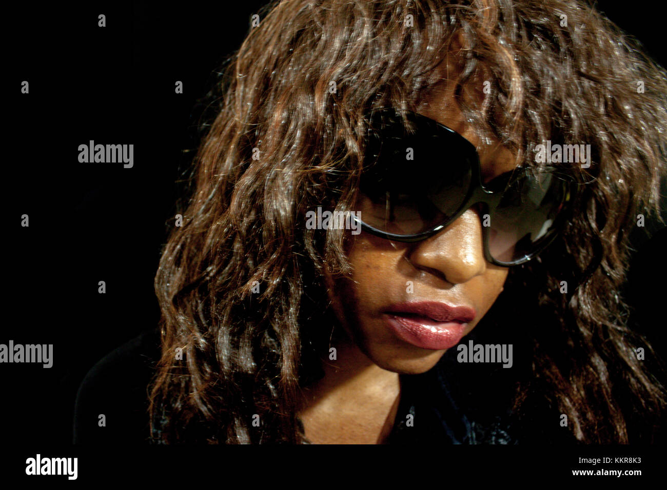 Woman Looking Off Camera Wearing Sunglasses Stock Photo - Alamy