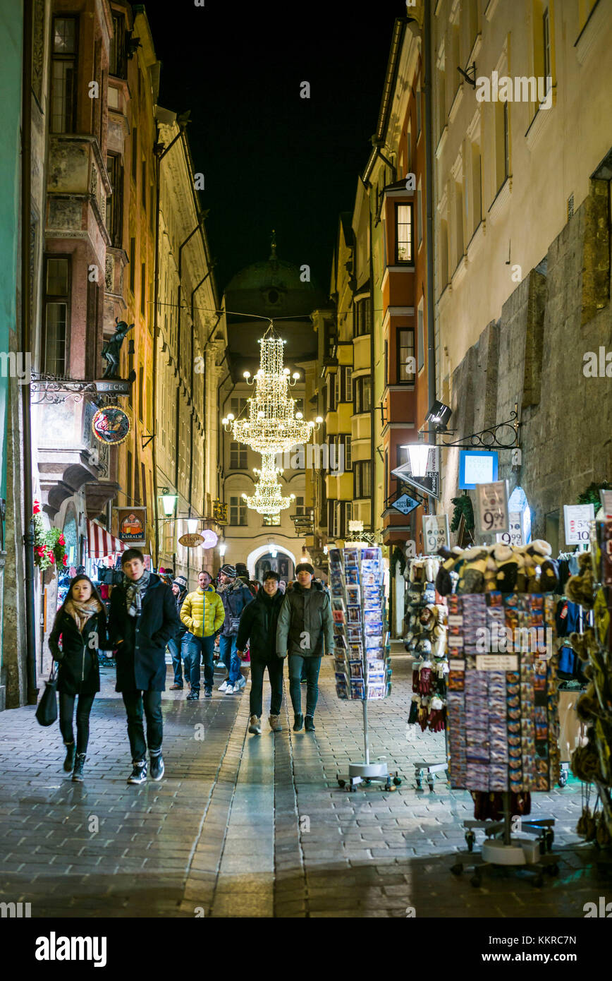 Austria, Tyrol, Innsbruck, tourists and souvenir shops, evening, winter ...