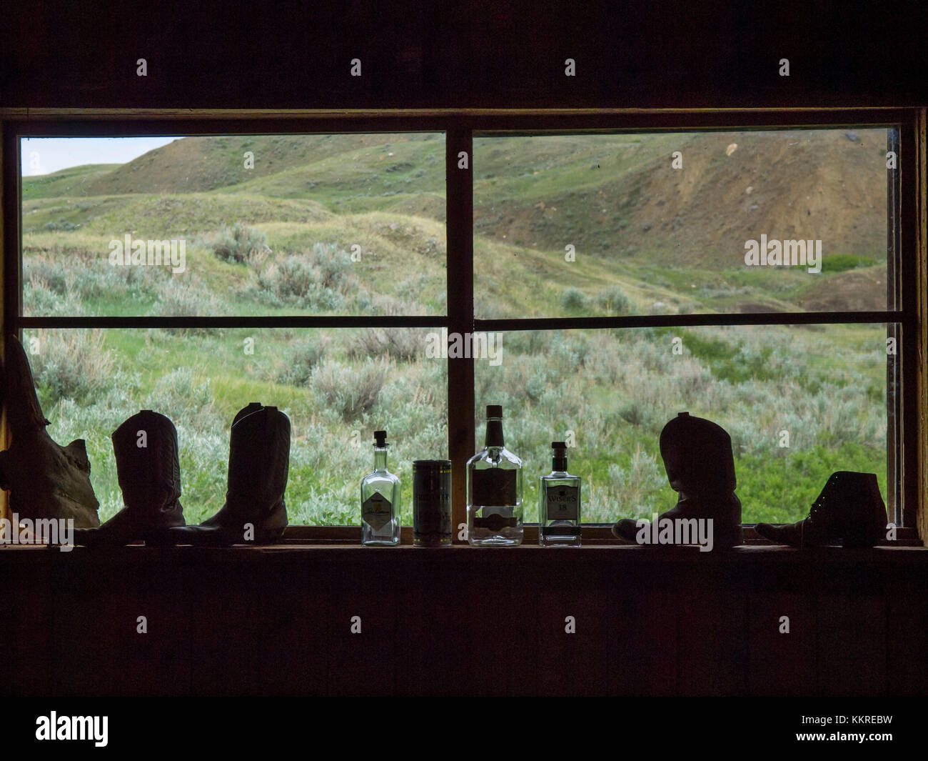 La Reata Ranch saloon, window, cowboy boots and bottles Stock Photo - Alamy