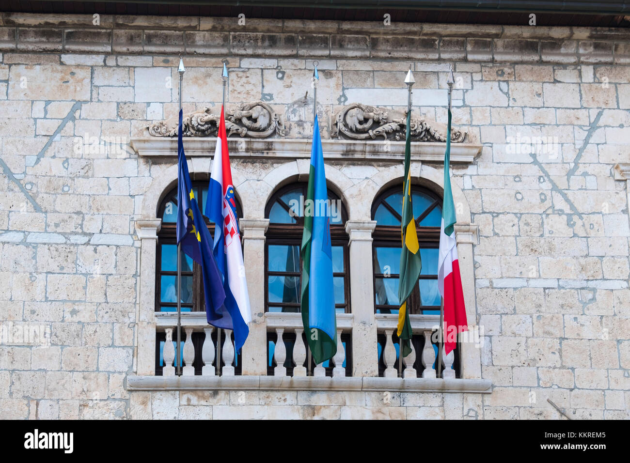 Croatia, Istria, Pola, Flags on the city hall Stock Photo - Alamy