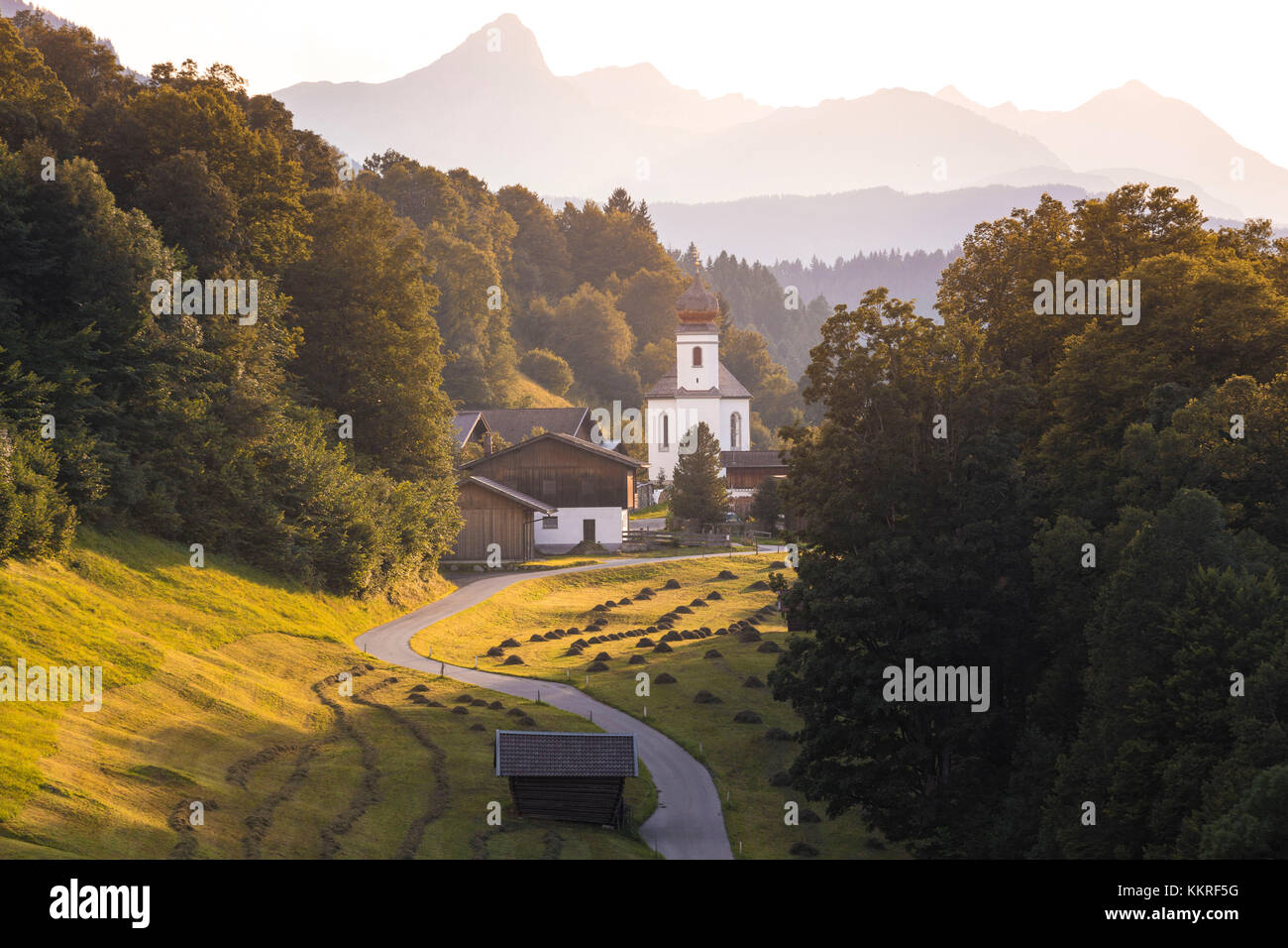 The iconic Wamberg Church, with Mount Alpspitze and Zugspitze on the ...