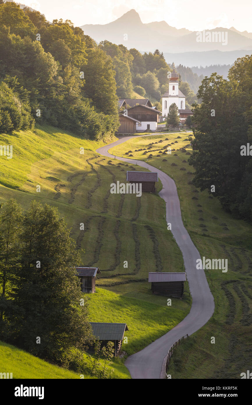 The iconic Wamberg Church, with Mount Alpspitze and Zugspitze on the ...