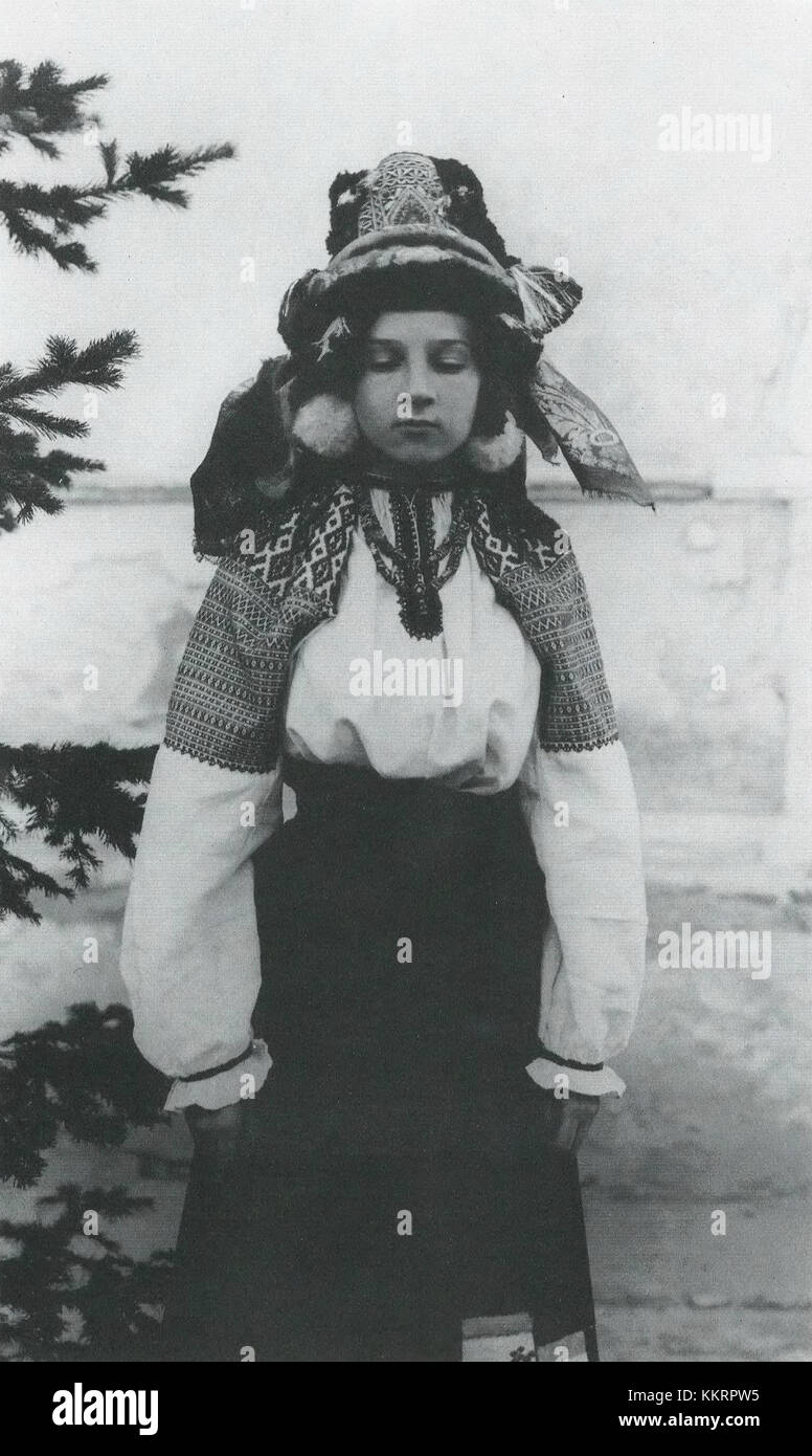 This early 20th-century photograph shows a woman in a feast dress from ...