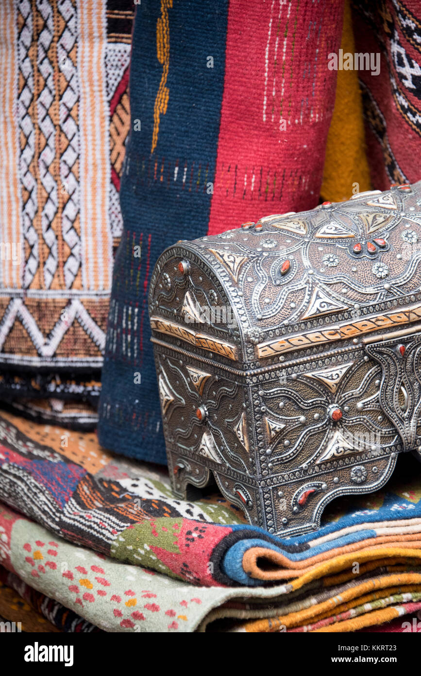 Ornate silver trinket box with colorful textiles on sale in a Moroccan ...