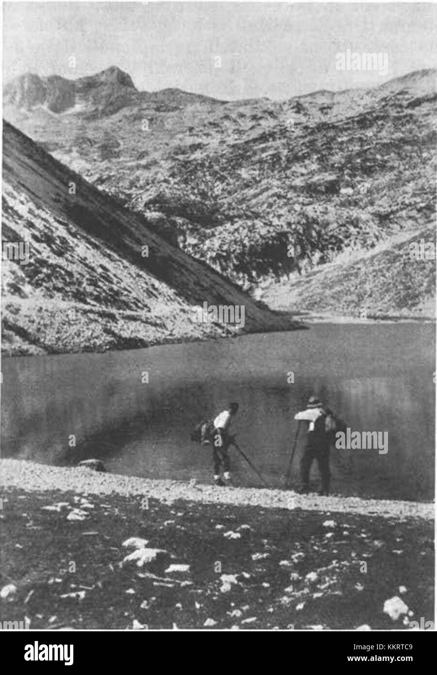 A historical photograph of Krnsko Lake with Mount Krn in the background ...