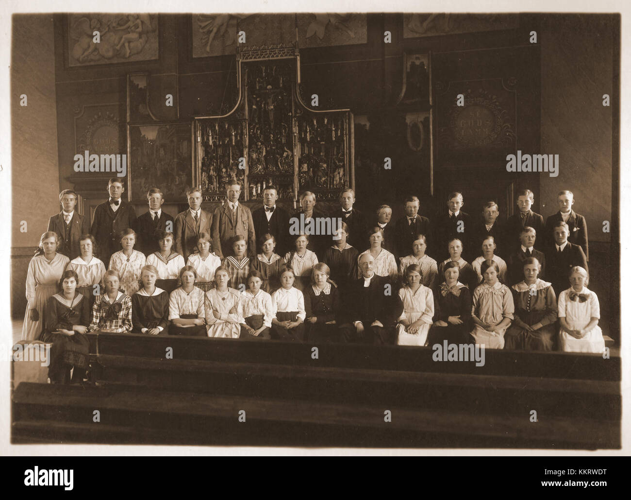 The photograph 'By kyrka konfirmation 1919' captures a significant ...