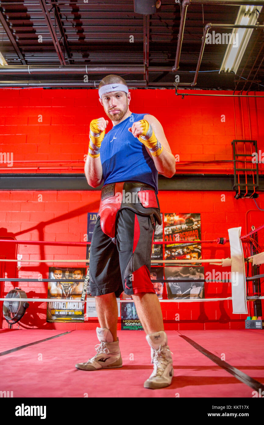 An amateur boxer poses after a sparring session at the gym Stock Photo ...