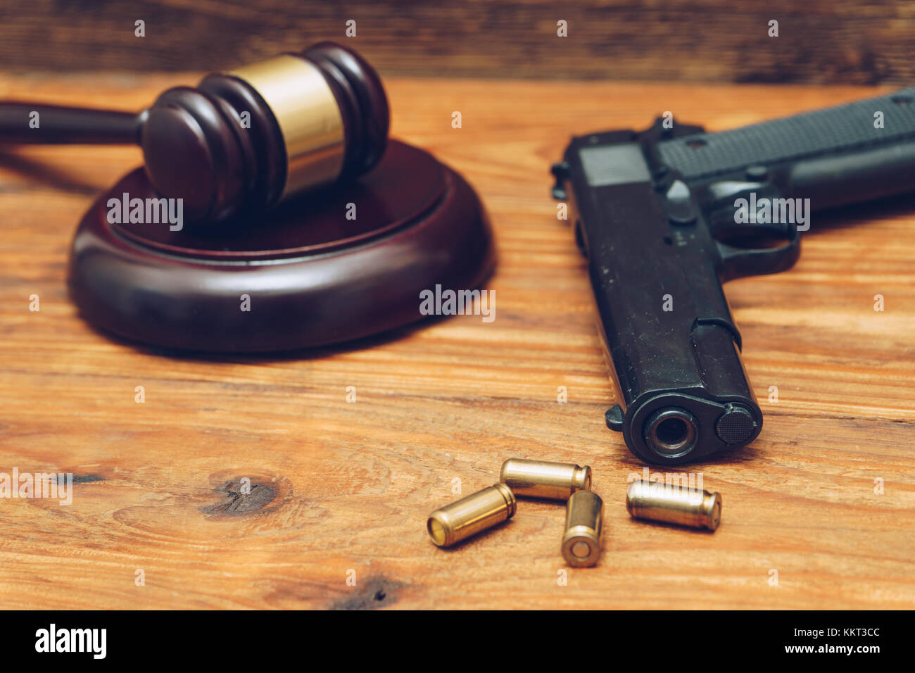 Judge gavel, handgun ανδ bullets on wooden background Stock Photo - Alamy