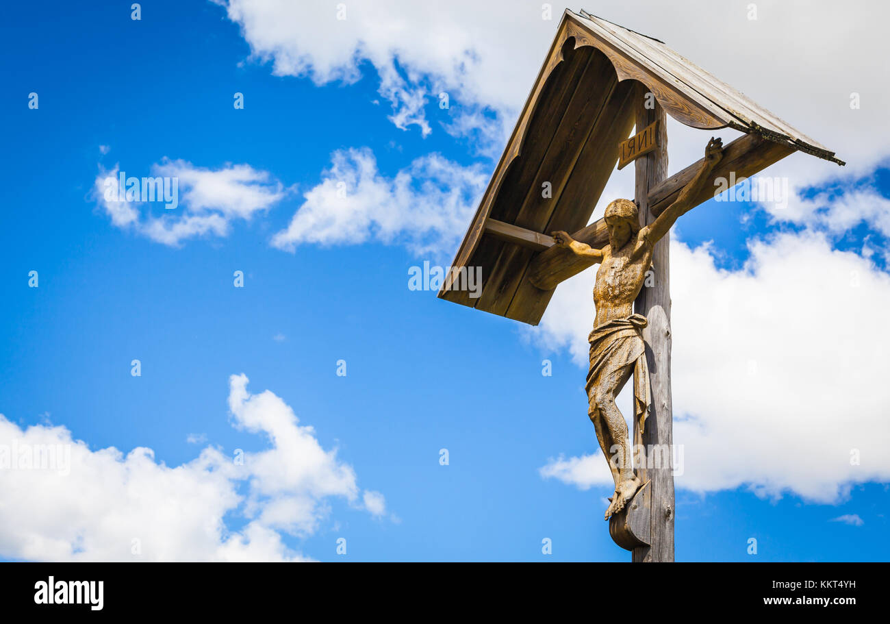 A 100 years old Crucifix, made of wood, tipical of Dolomity Region in ...