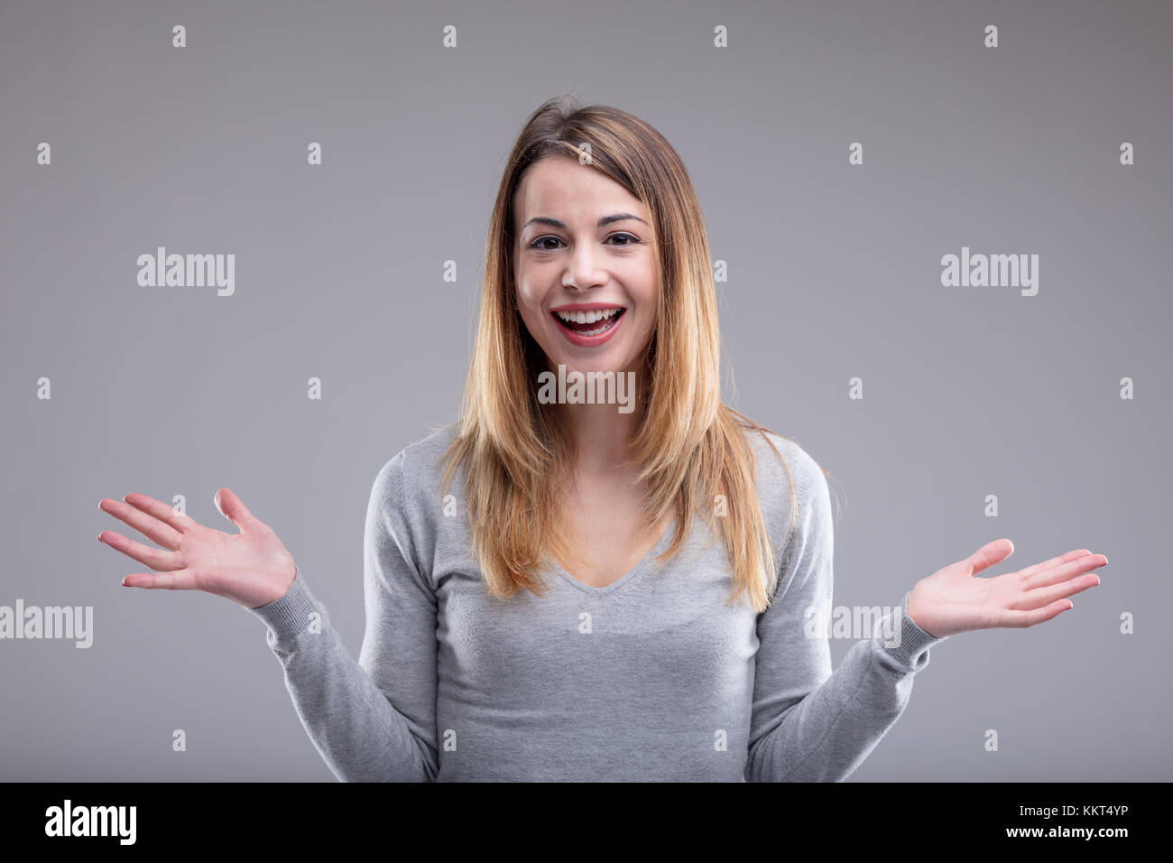 beautiful smiling woman showing open hands - that's it concept Stock ...