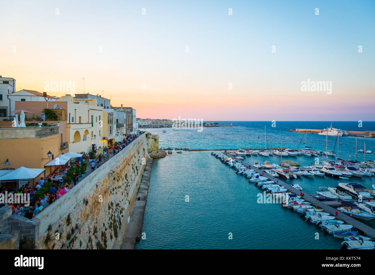 At peak of turistic season, the turist crowd is walking at sunset on ...