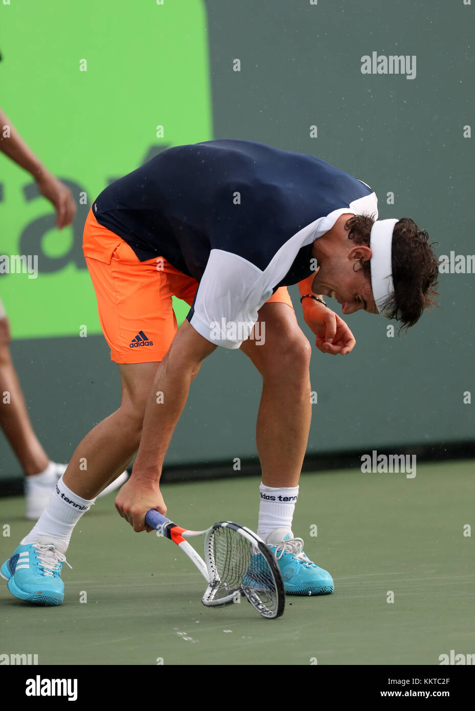 KEY BISCAYNE, FL - MARCH 25: Dominic Thiem breaks his racket on day 6 ...