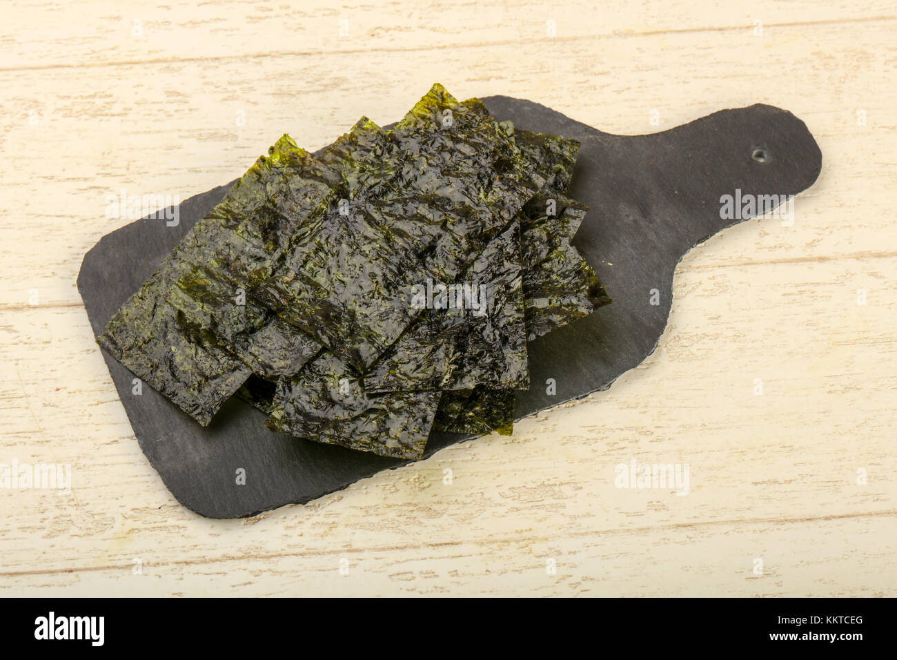 Crispy Nori sheets chips over wooden background Stock Photo - Alamy