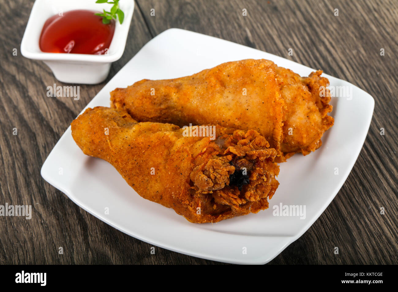 Crispy chicken legs with ketchup Stock Photo - Alamy